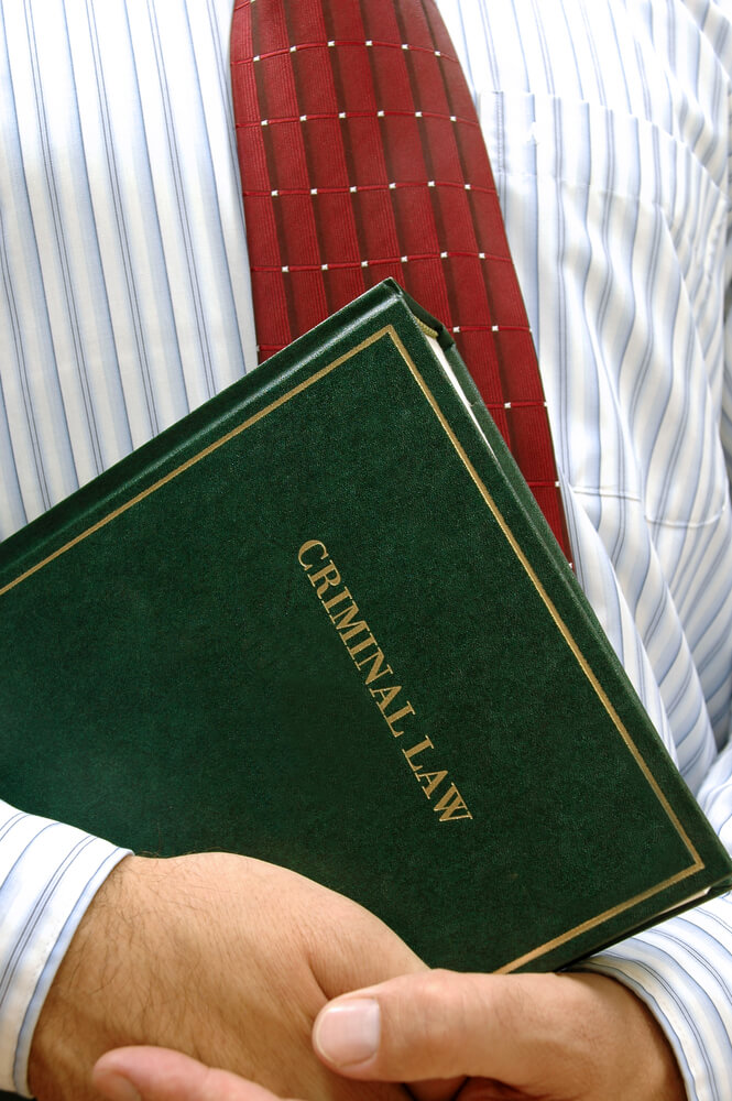 man_with_criminal_law_book - The Law Office of Michael A Troiano